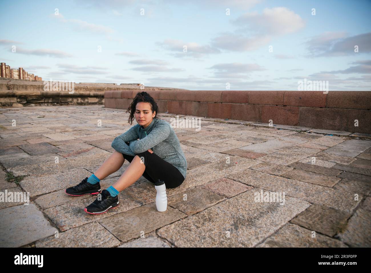 tired girl resting after exercise Stock Photo - Alamy