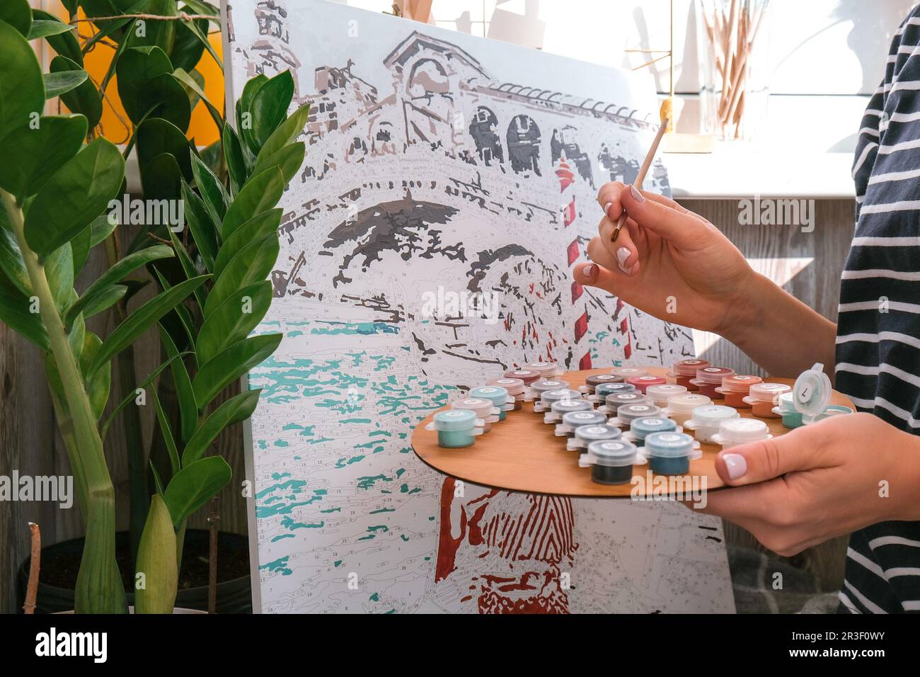 Female hands coloring canvas Picture by numbers Creative hobby. Painting for beginners. Leisure ...