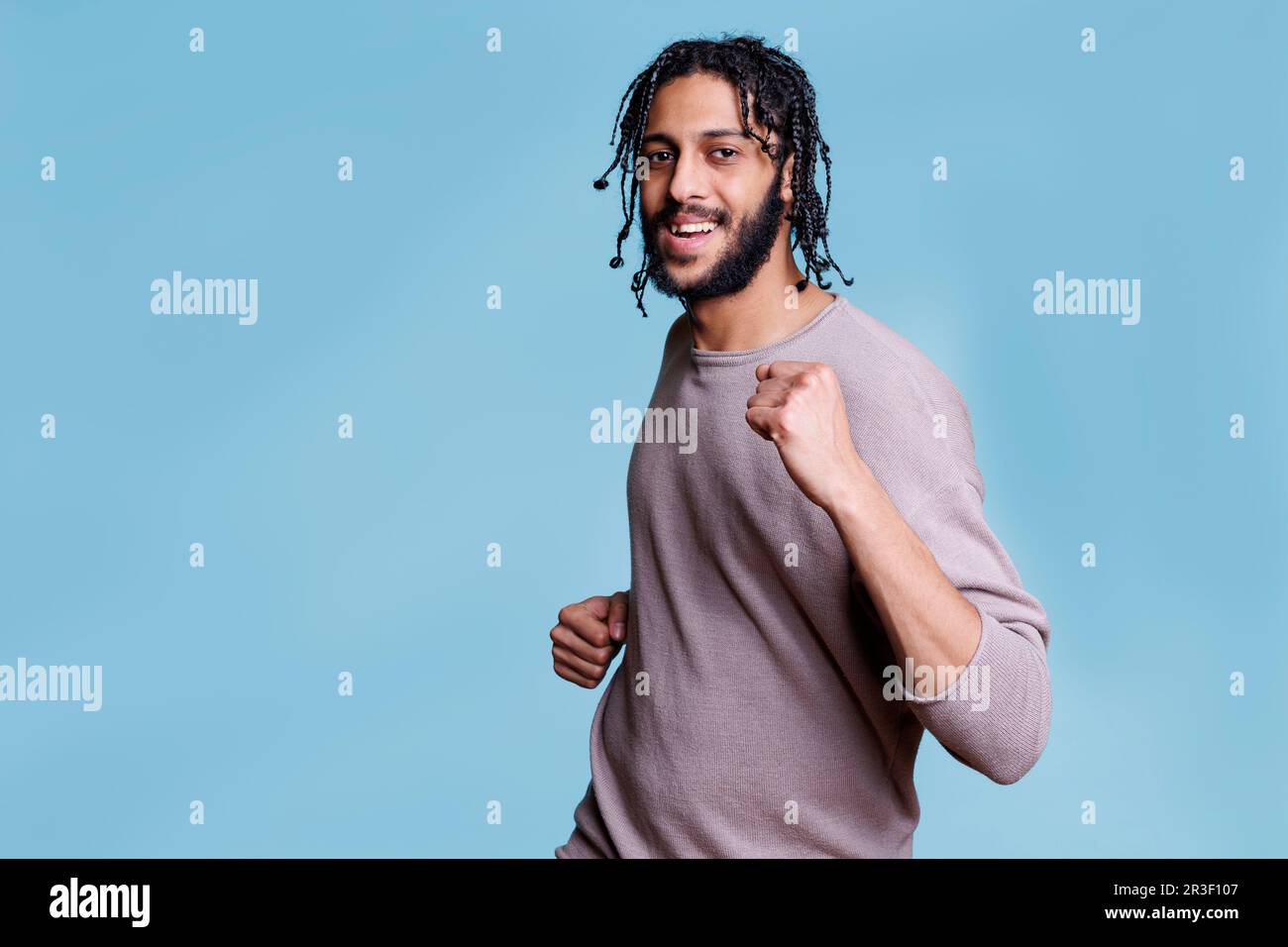 Happy handsome arab man dancing and partying Stock Photo - Alamy