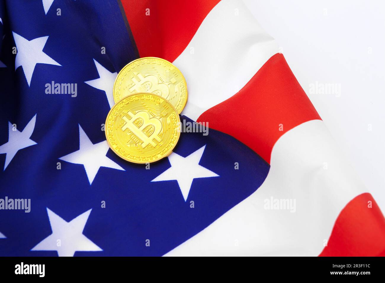 Bitcoin physical coins on American flag background with dollars Stock ...