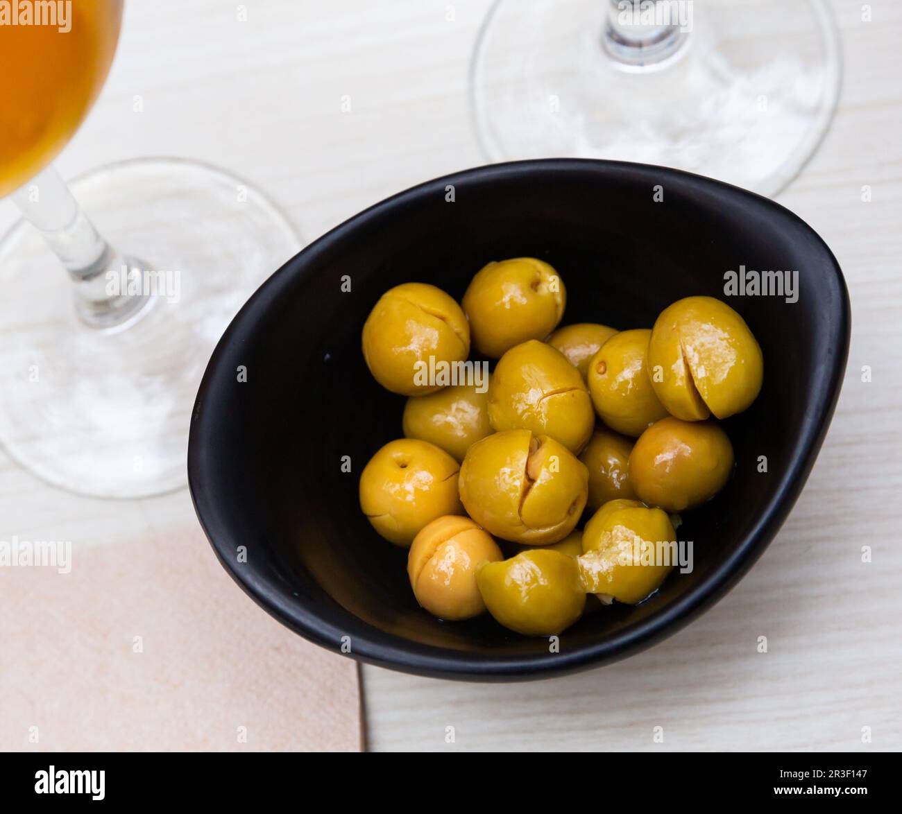 Pickled olives with a stone - a typical Spanish tapas Stock Photo - Alamy