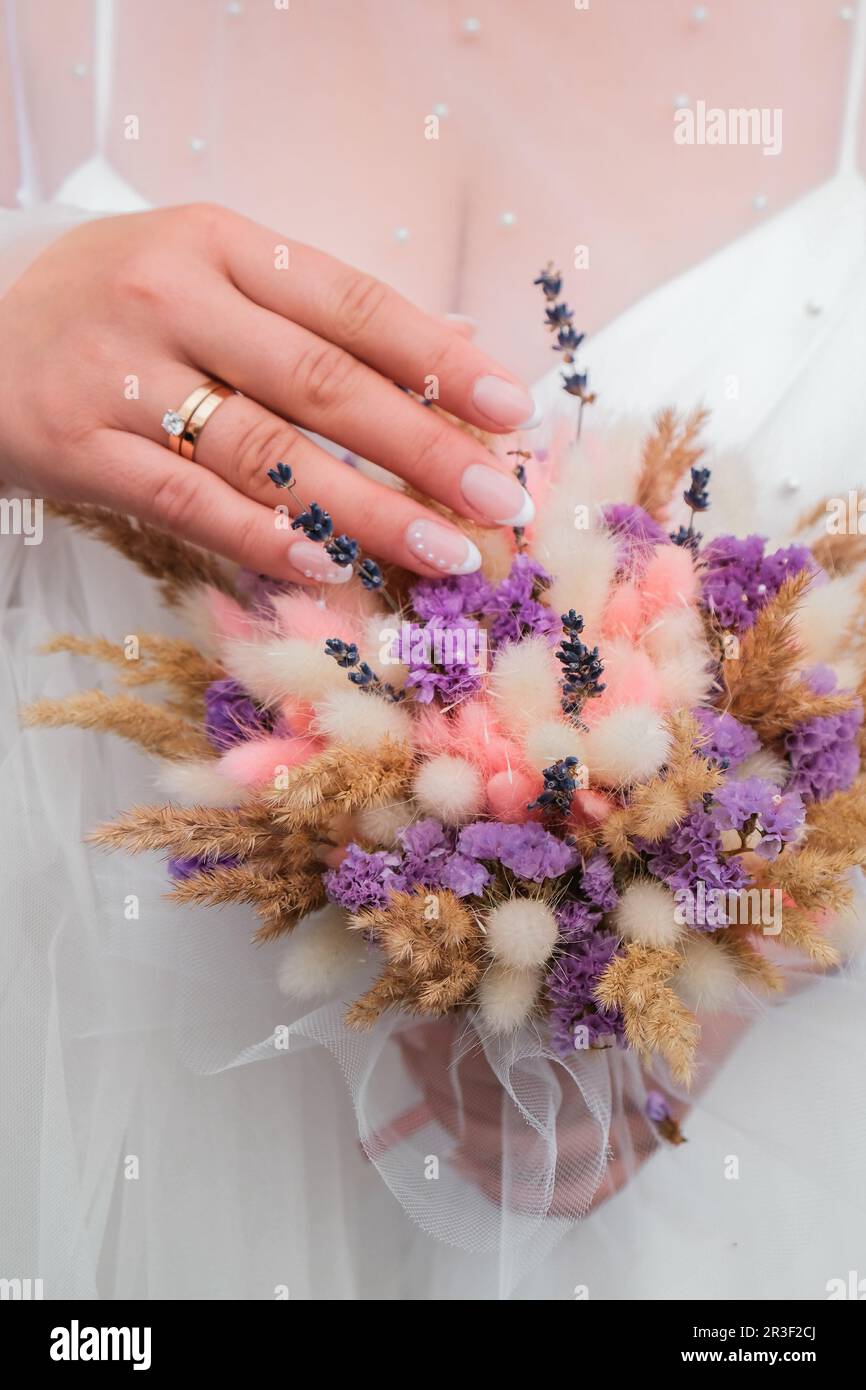 Weeding flowers background in hands. Bride holding her weeding bouquet ...