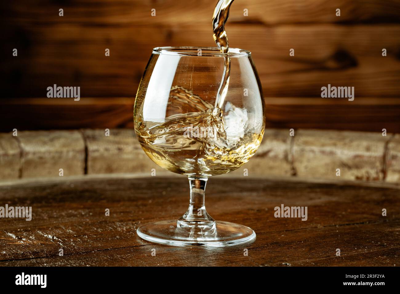 Double whiskey being poured into a glass Stock Photo - Alamy