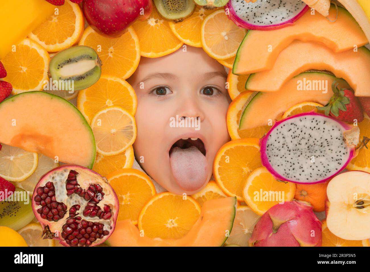 Funny fruits. Kid smiling face portrait surrounded by fruits. Kids face ...