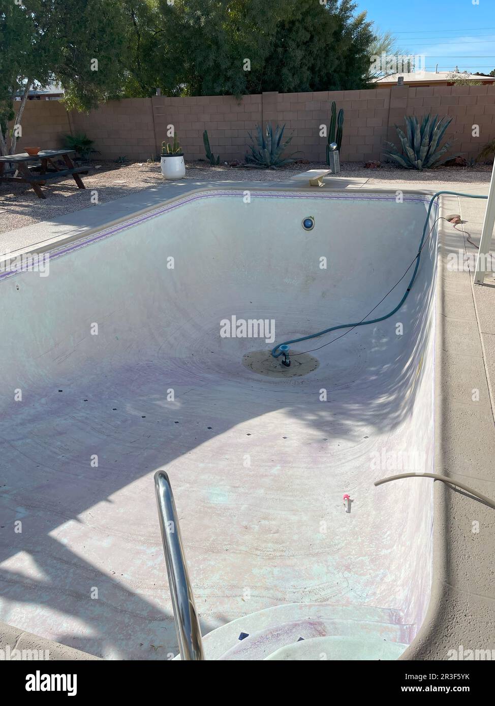 Emty of water, this swimming pool needs an acid wash before refilling ...