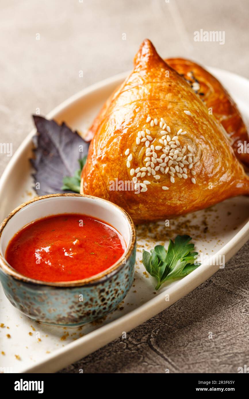 Samosa, samsa meat stuffed pies. Uzbek national dish samosa. Concept of Central Asian, South and ...