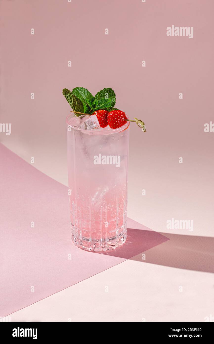 Cold alcoholic or non-alcoholic cocktail on pastel background. Hard ...