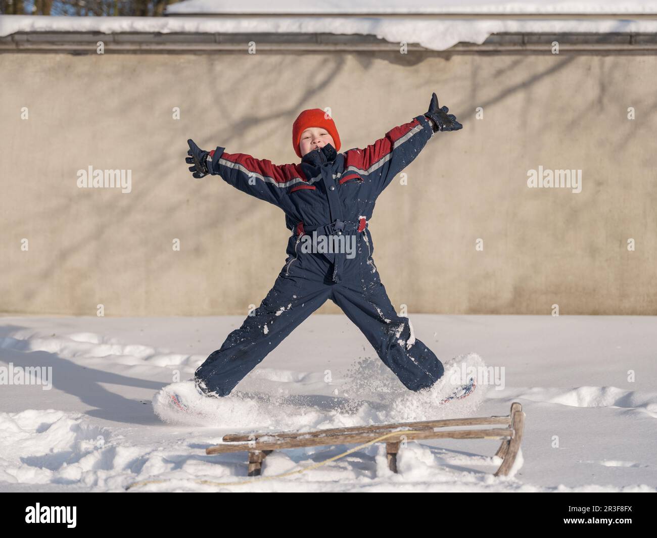 Boy in the snow Stock Photo - Alamy
