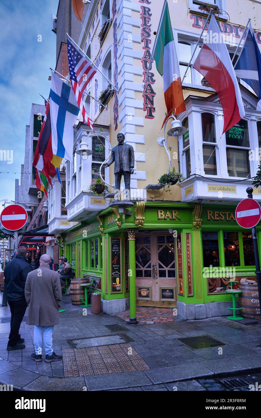 Colorful Dublin pub surrounded by international flags Stock Photo - Alamy