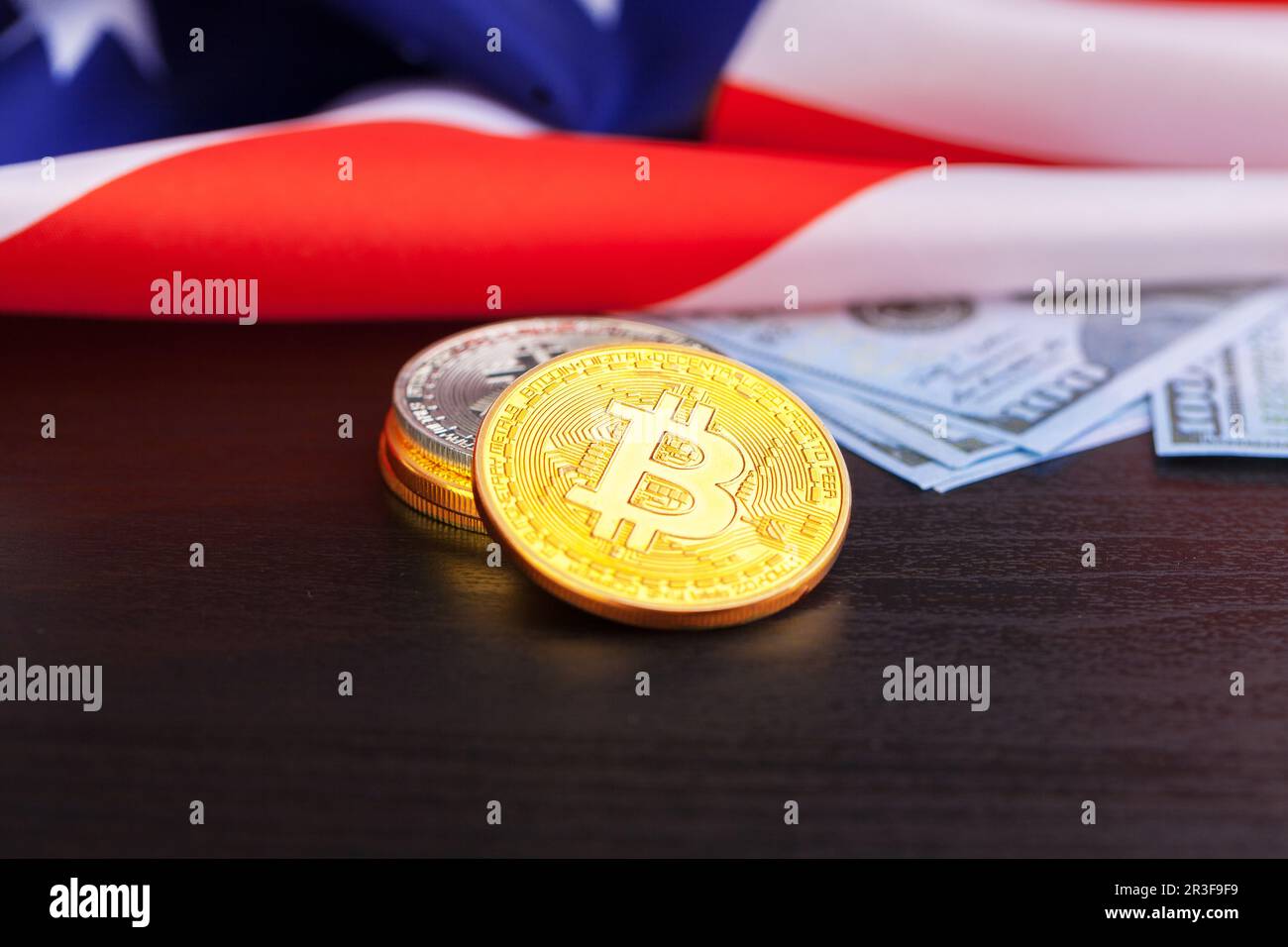 Bitcoin physical coins on American flag background with dollars Stock ...