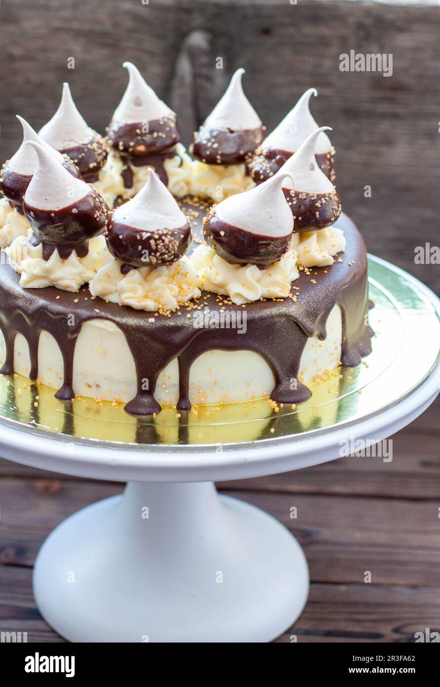 Birthday cheesecake decorated with melted dark chocolate sauce ...