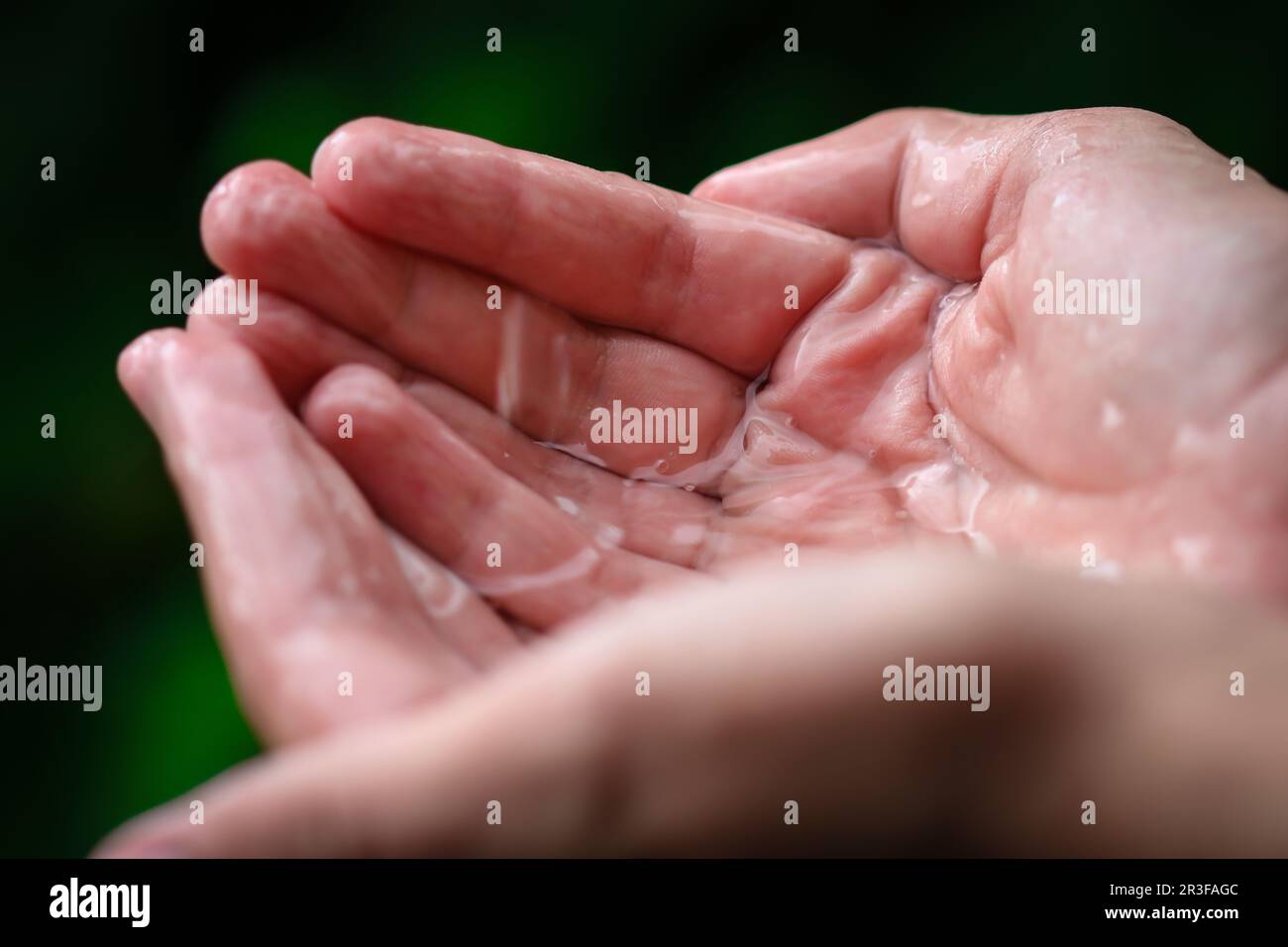 Boy catching raindrop hi-res stock photography and images - Alamy