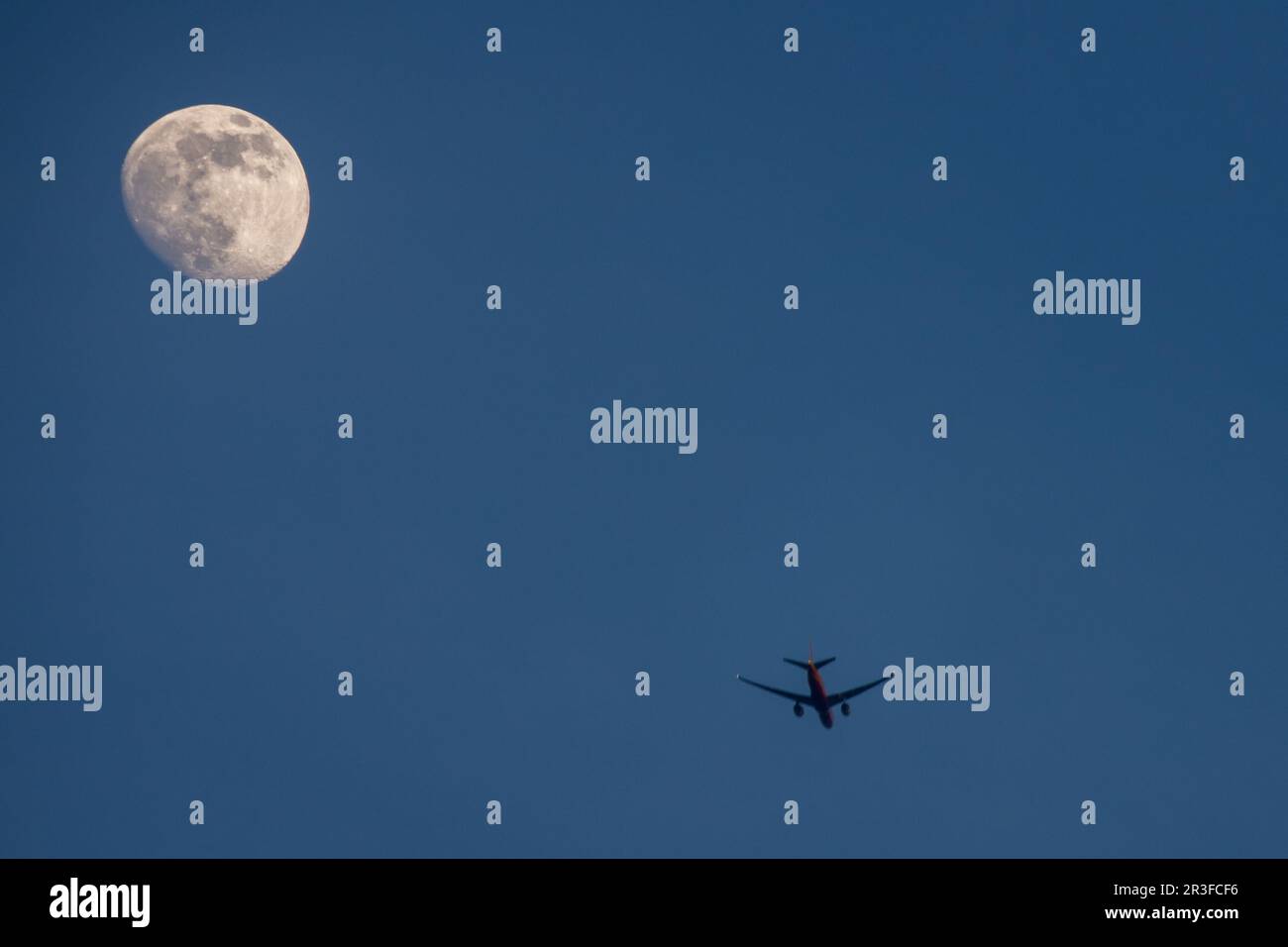 Moon and plane Stock Photo - Alamy