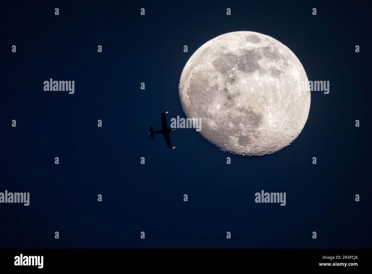 Moon and plane Stock Photo - Alamy