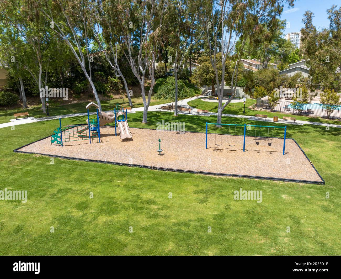 Aerial view of recreational facilities with kids playgorund in private ...