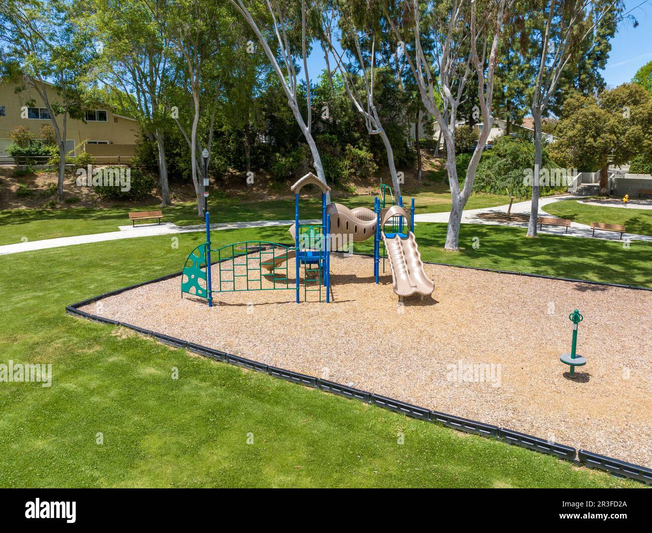 Aerial view of recreational facilities with kids playgorund in private ...