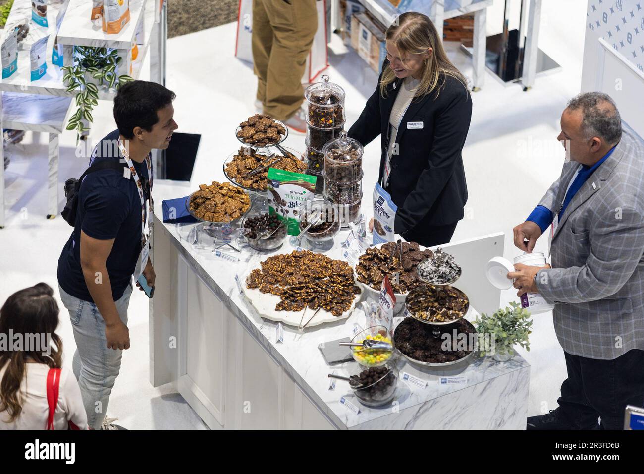 Chicago, USA. 23rd May, 2023. An attendee talks with exhibitors at a ...