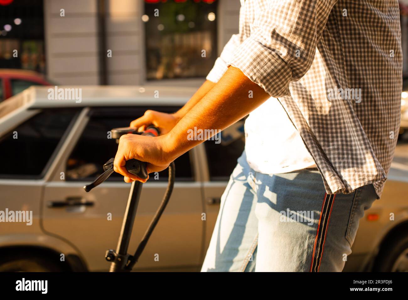 The man deftly rides an electric scooter Stock Photo - Alamy