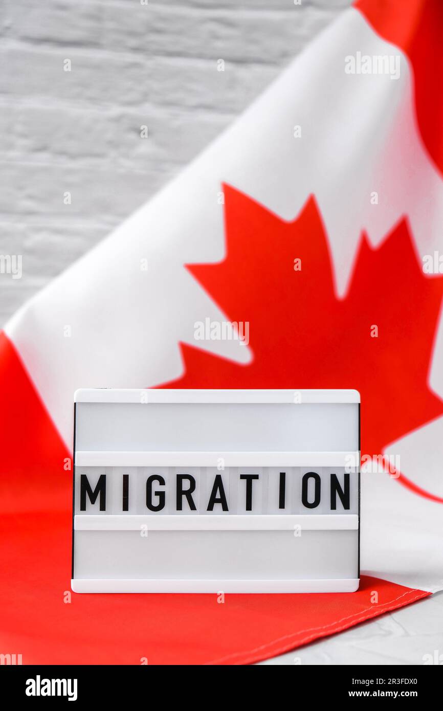 The National Flag of Canada. Lightbox with text MIGRATION Canadian Flag ...