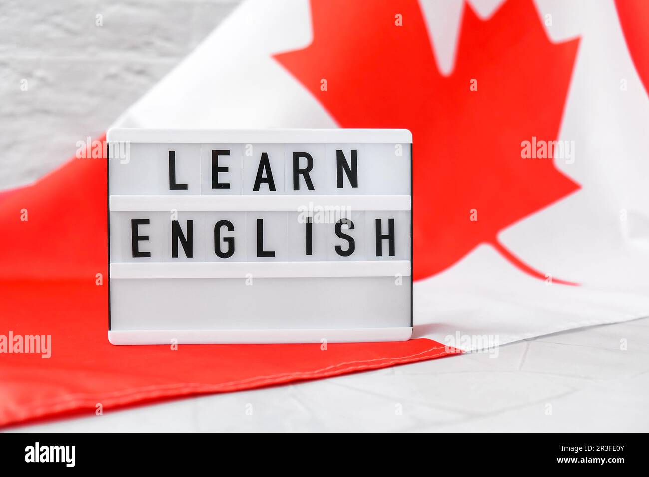 The National Flag of Canada. Lightbox with text LEARN ENGLISH Canadian ...