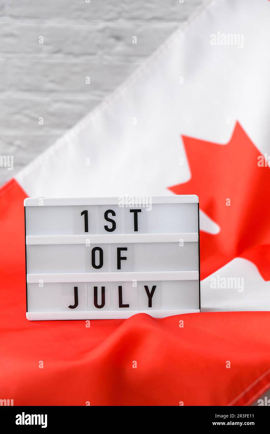 The National Flag of Canada. Lightbox with text Canadian 1ST OF JULY ...