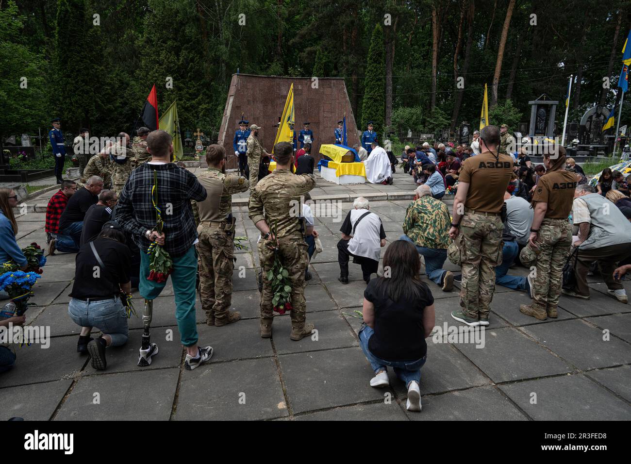 Ukrainian servicemen from the Azov Regiment salute their comrade Andrii ...