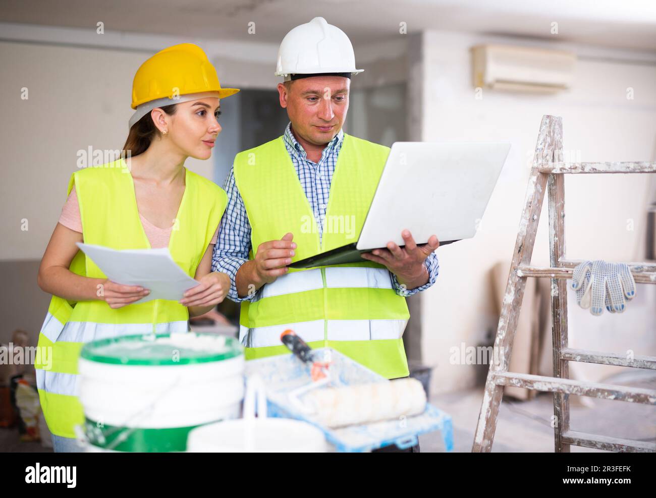 Construction workers working at house being renovated Stock Photo - Alamy