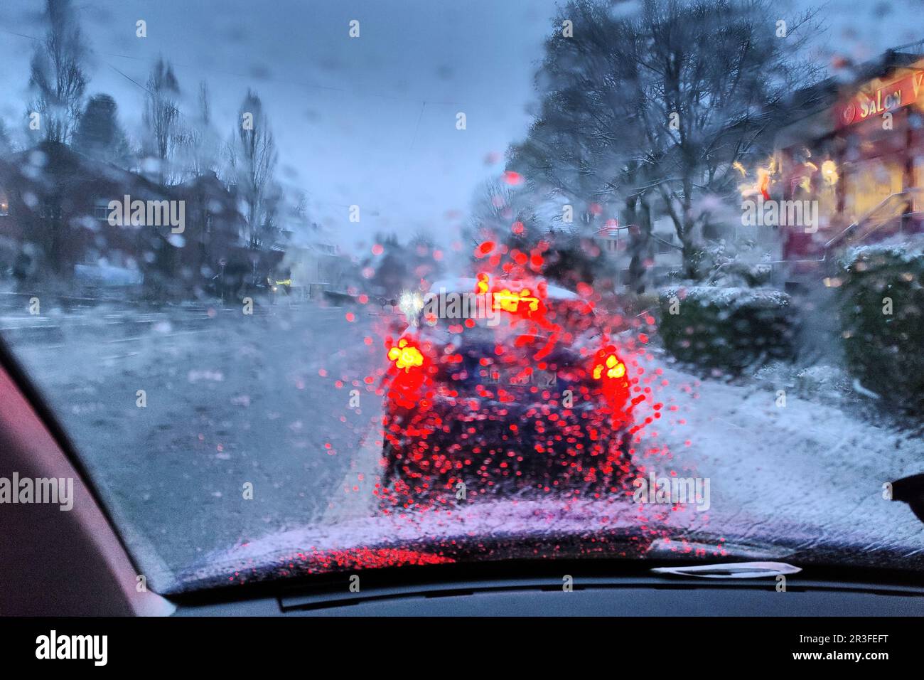 View from the car through a rain-soaked pane with an unclear view in ...