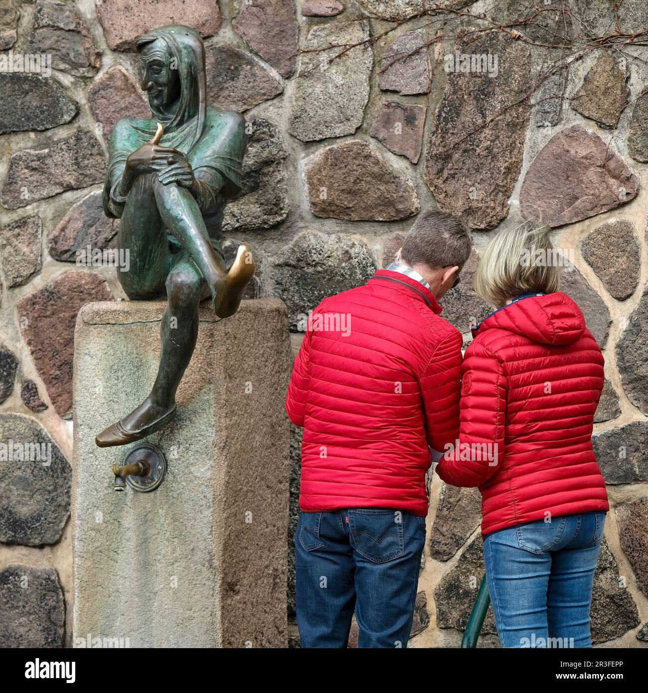 People at the Till Eulenspiegel sculpture, Moelln, Schleswig-Holstein ...