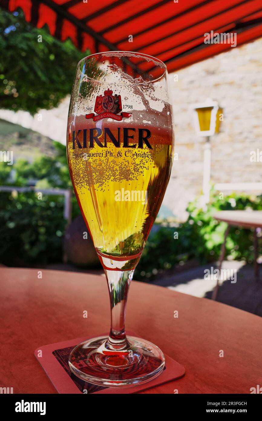 Cold tall glass of German Kirner Beer on Outdoor Patio Stock Photo - Alamy