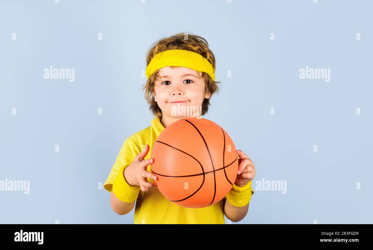 Sportsman child with basketball ball. Sport equipment. Cute boy playing ...