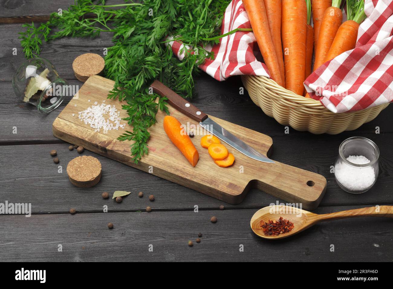 chopping healthy carrots on slice on chopping board in the kitchen ...