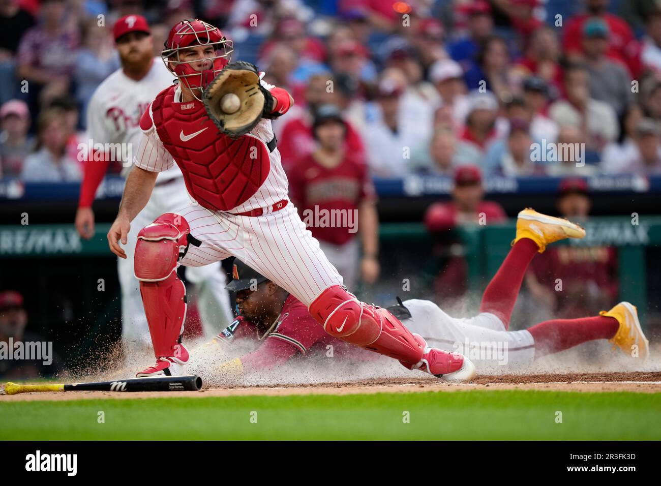 Arizona Diamondbacks' Geraldo Perdomo, right, scores past Philadelphia ...