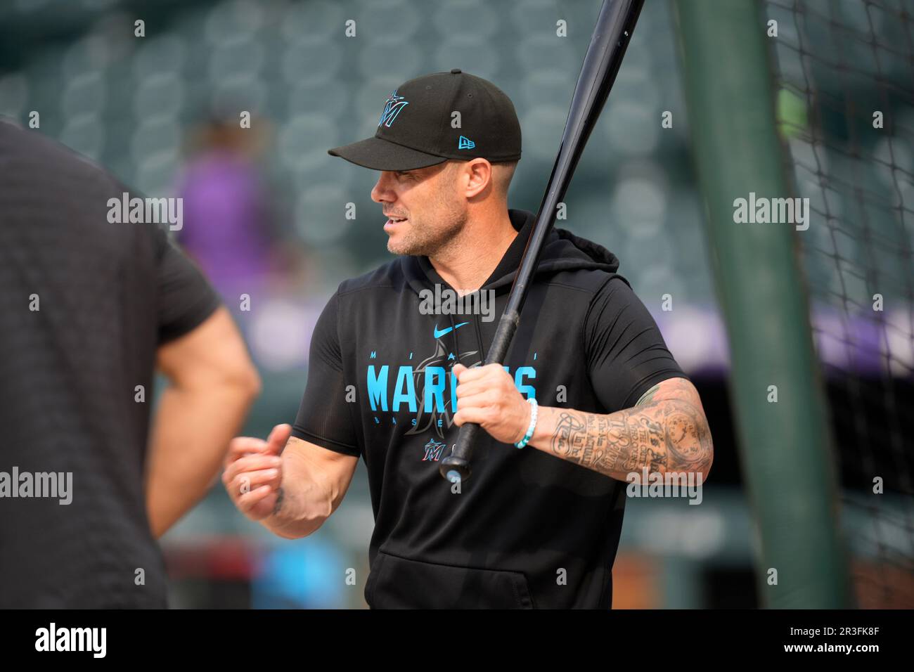Miami Marlins manager Skip Schumaker hits ground balls to infielders as ...
