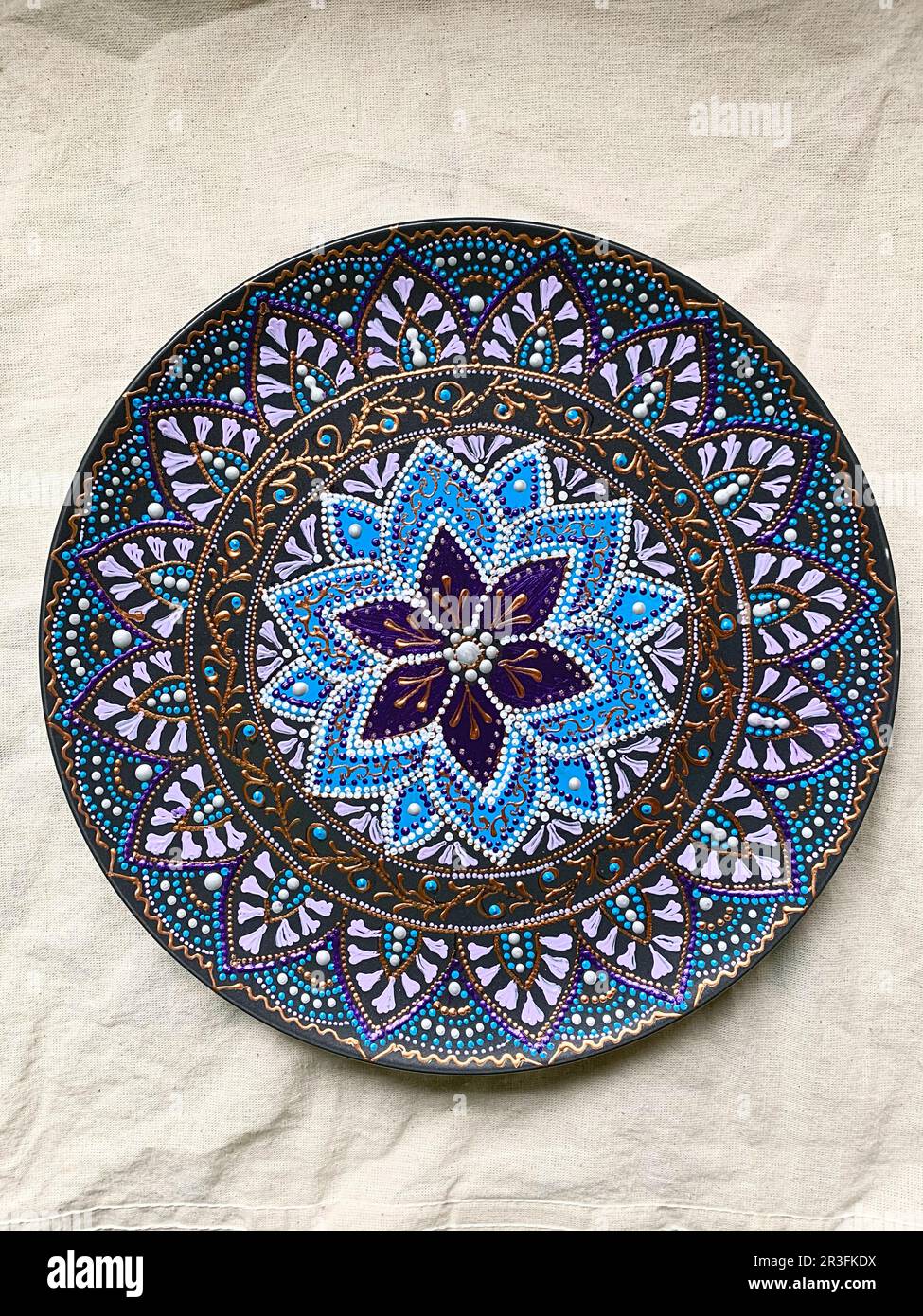 Decorative ceramic plate with different colors. painted plate on white ...