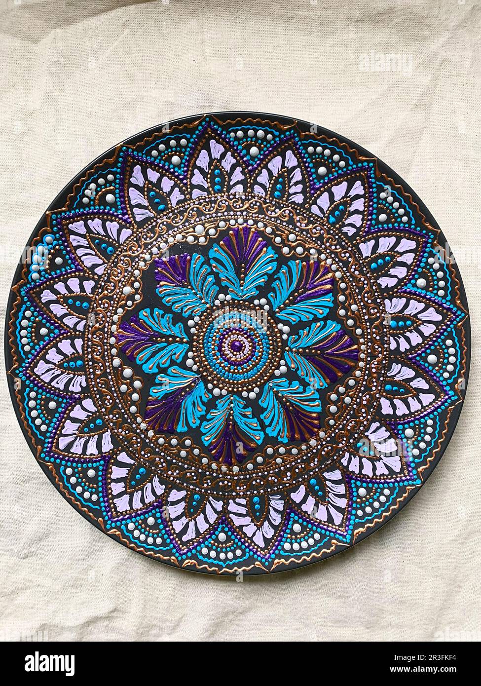 Decorative ceramic plate with different colors. painted plate on white ...