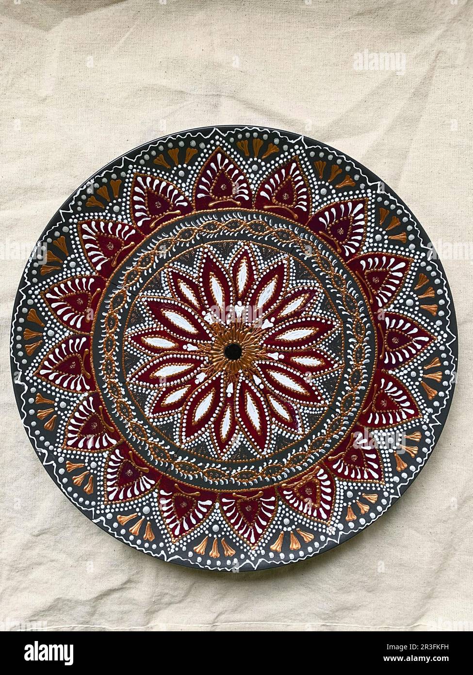 Decorative ceramic plate with different colors. painted plate on white ...