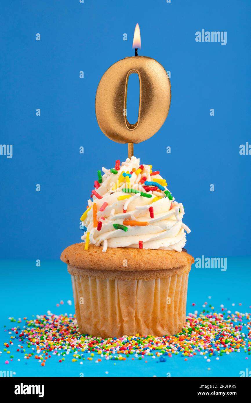 Birthday cake with candle number 0 - Blue background Stock Photo - Alamy