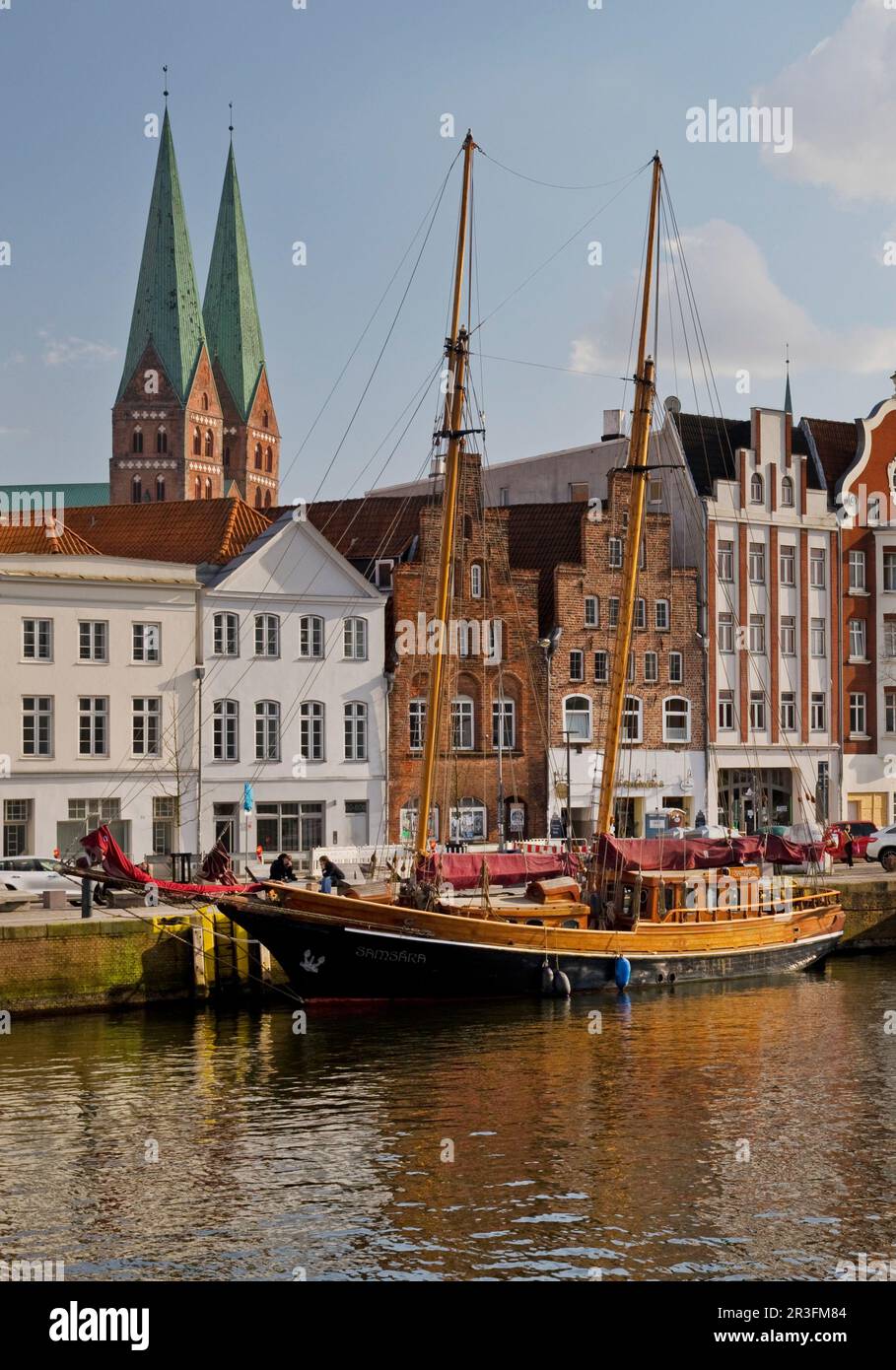 Boats on the Trave in the museum harbor with the church tower of St ...