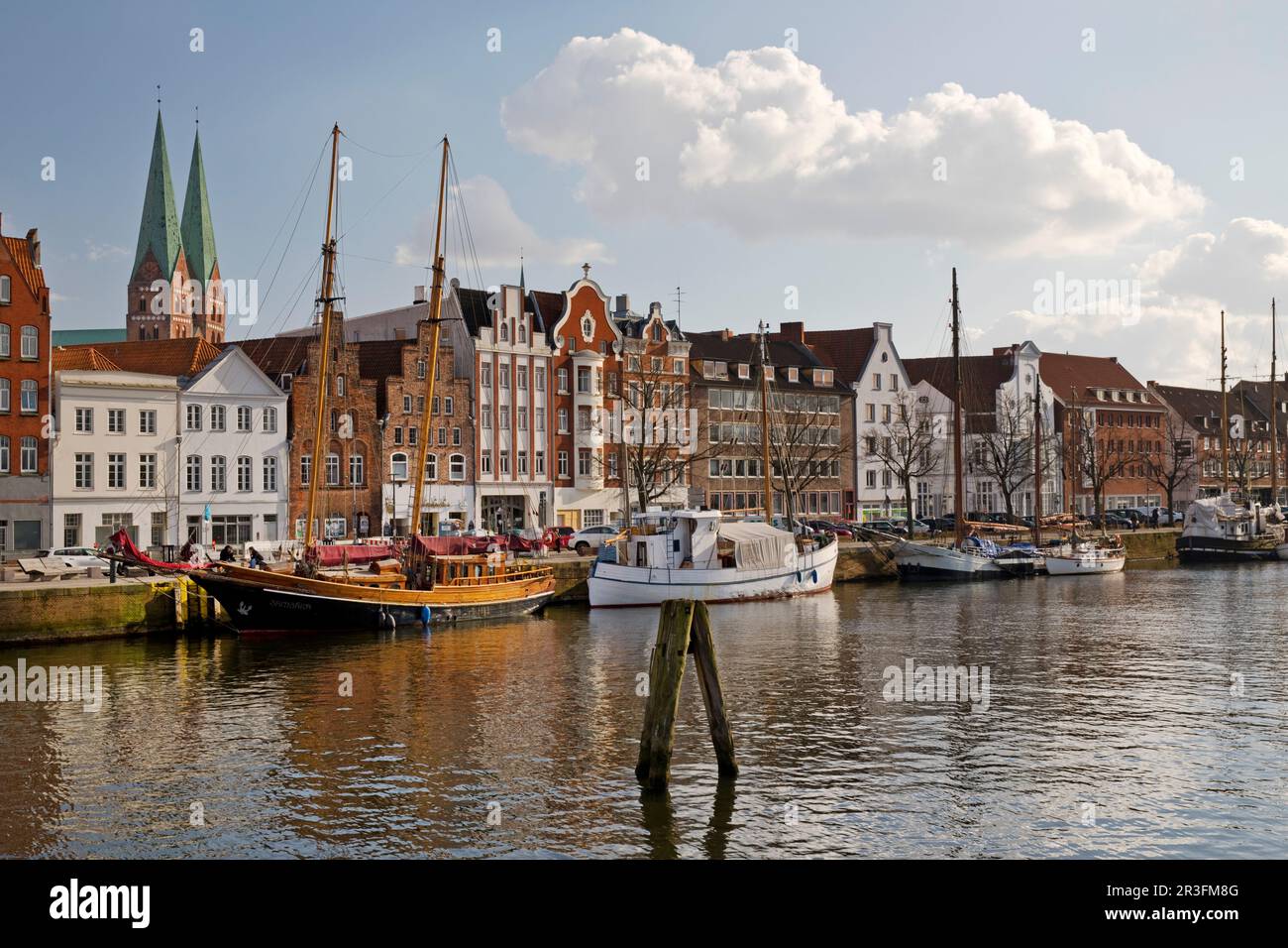 Boats on the Trave in the museum harbor with the church tower of St ...