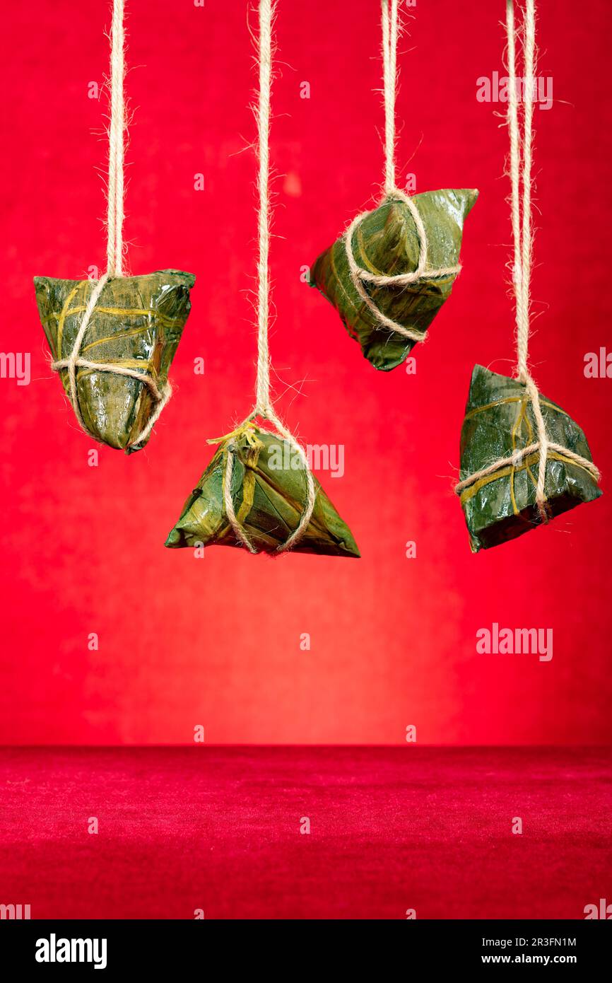 traditional Chinese ZongZi for dragon boat festival on red vertical ...