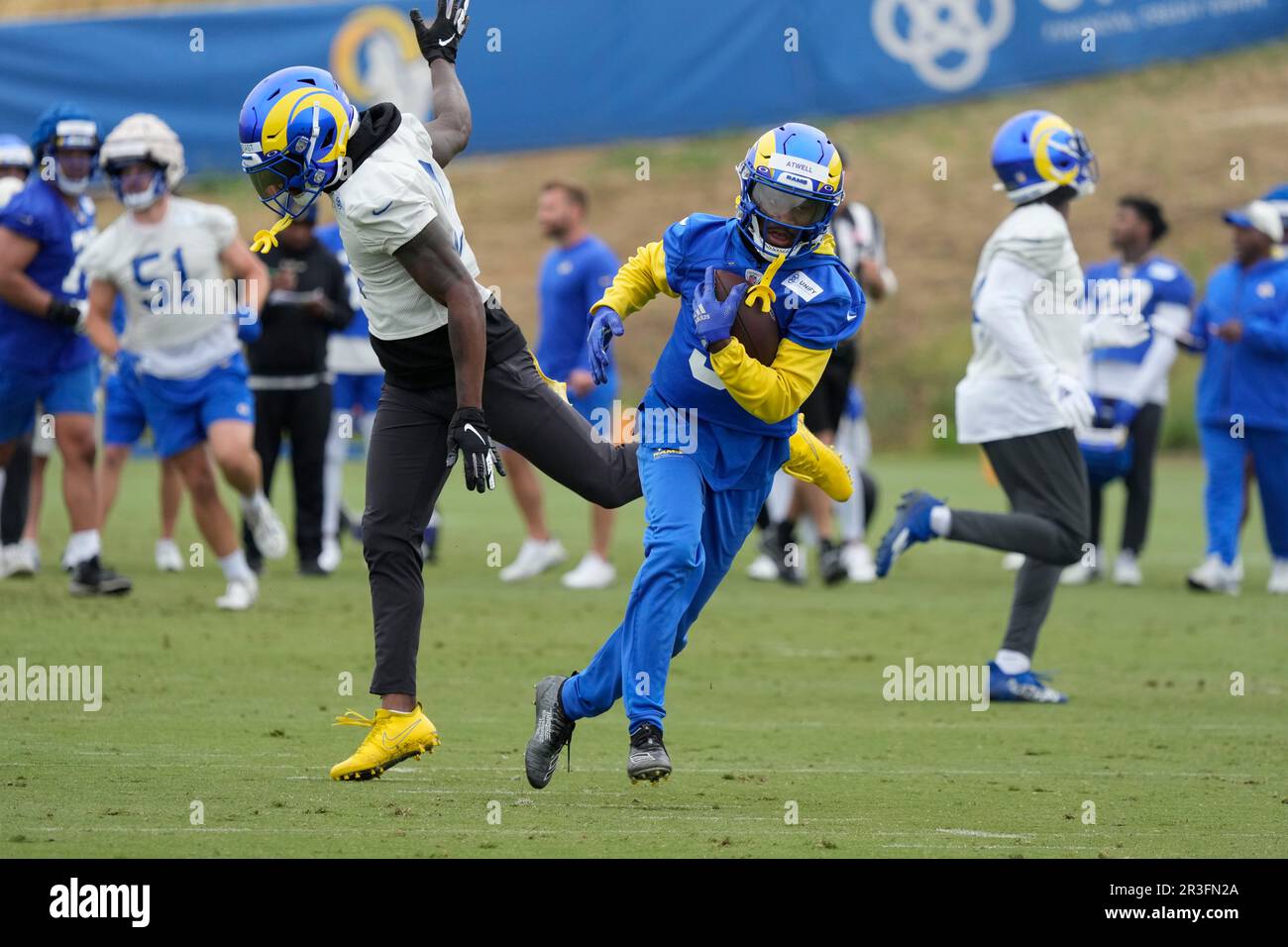 Los Angeles Rams wide receiver Tutu Atwell, center, runs past safety ...