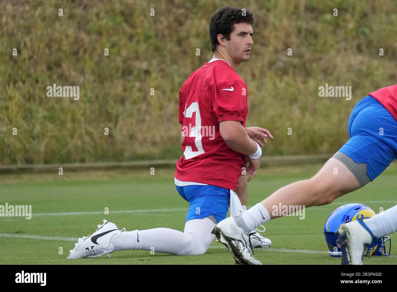 Los Angeles Rams quarterback Stetson Bennett stretches during the NFL ...