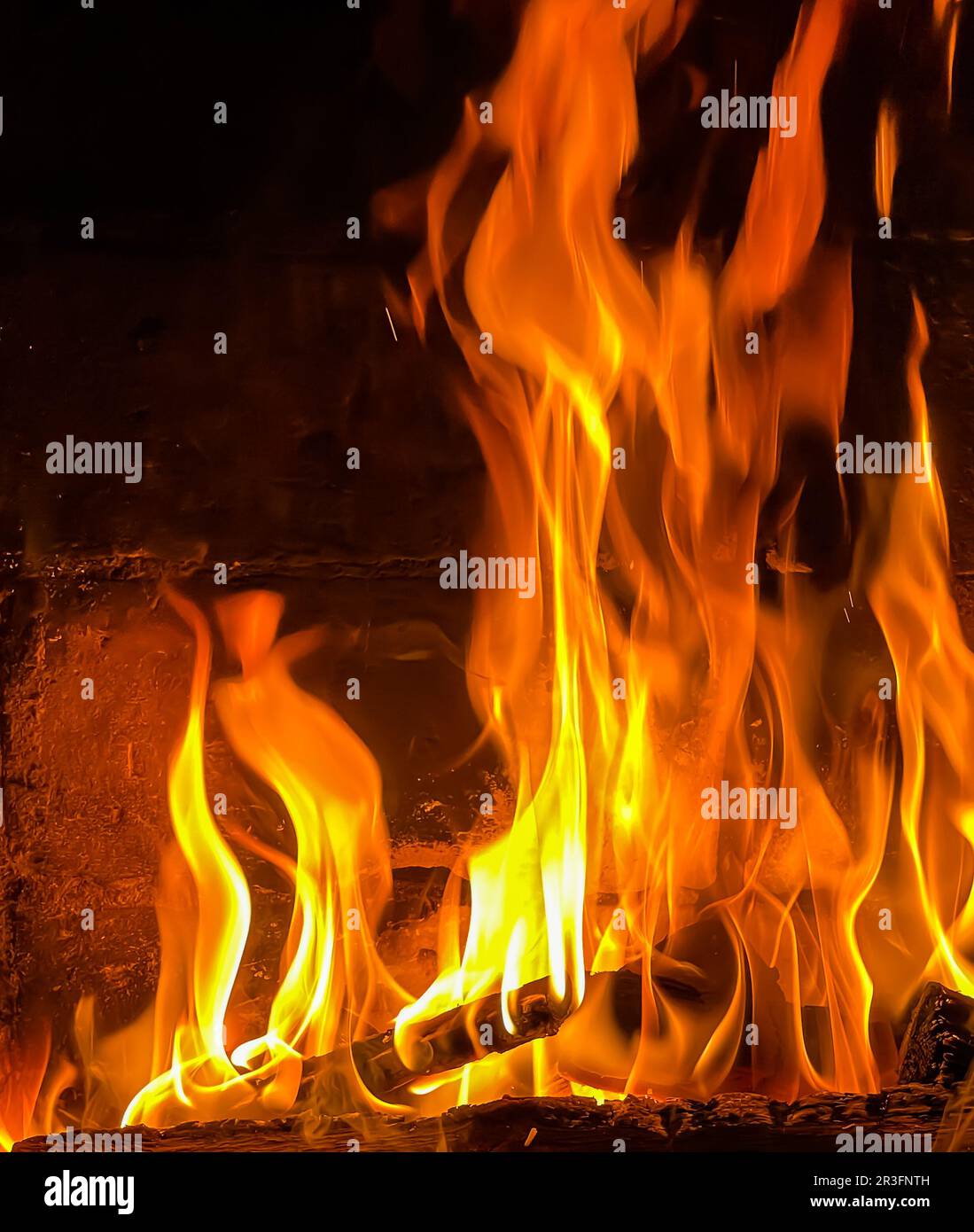 Flames of fire and hot coals of burned wood in the fireplace Stock ...