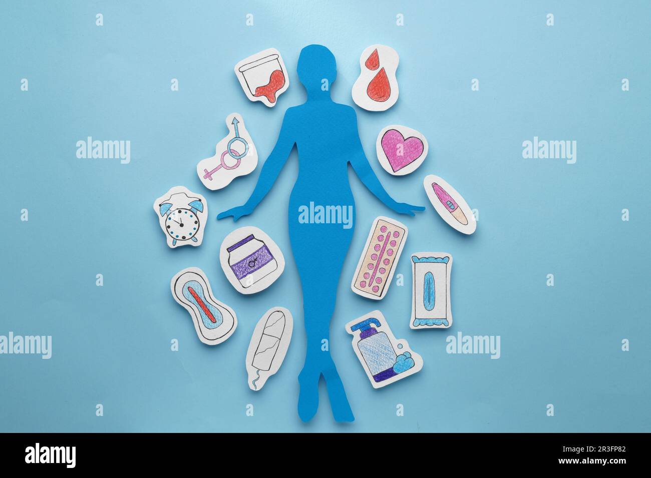 Woman paper figure with personal hygiene products and gender sign on ...