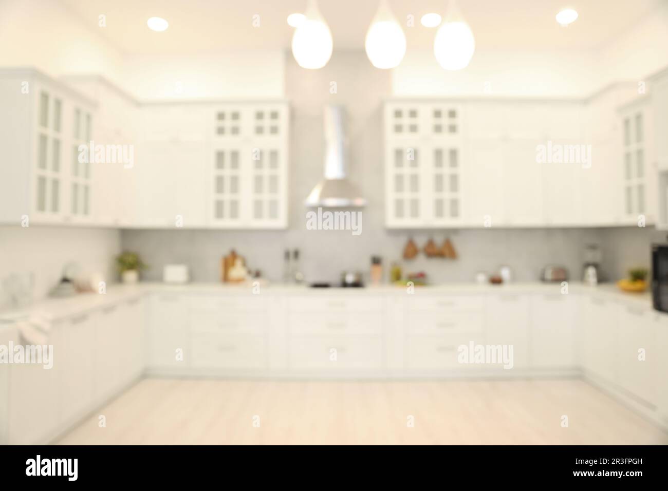 Blurred view of modern kitchen. Interior design Stock Photo - Alamy