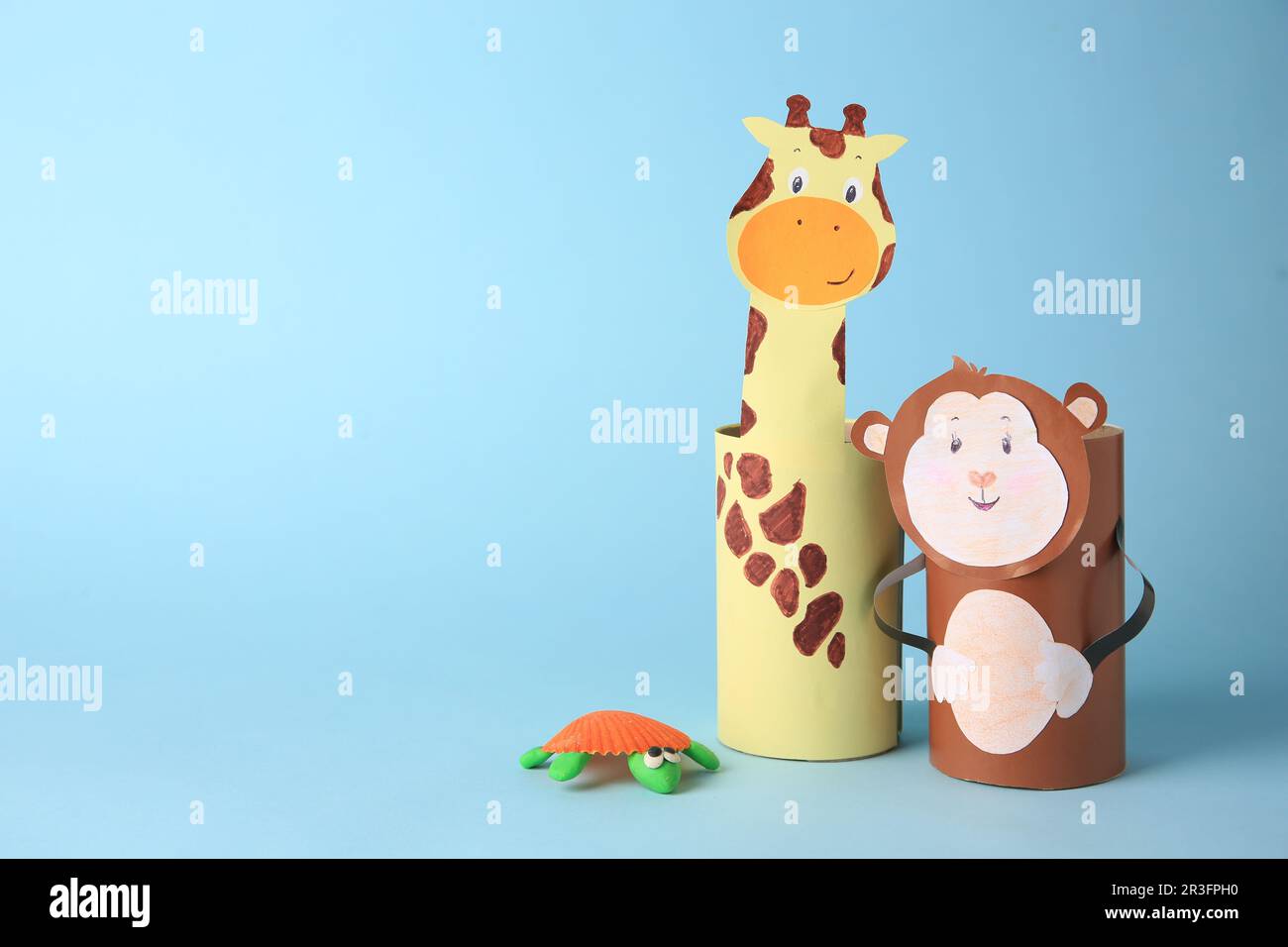 Toy monkey and giraffe made from toilet paper hubs with plasticine ...