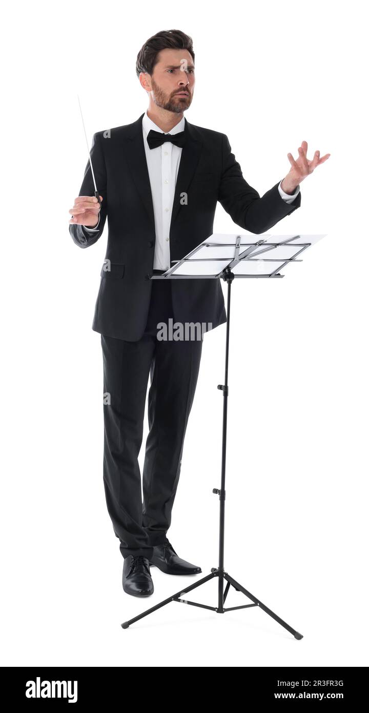 Professional conductor with baton and note stand on white background ...