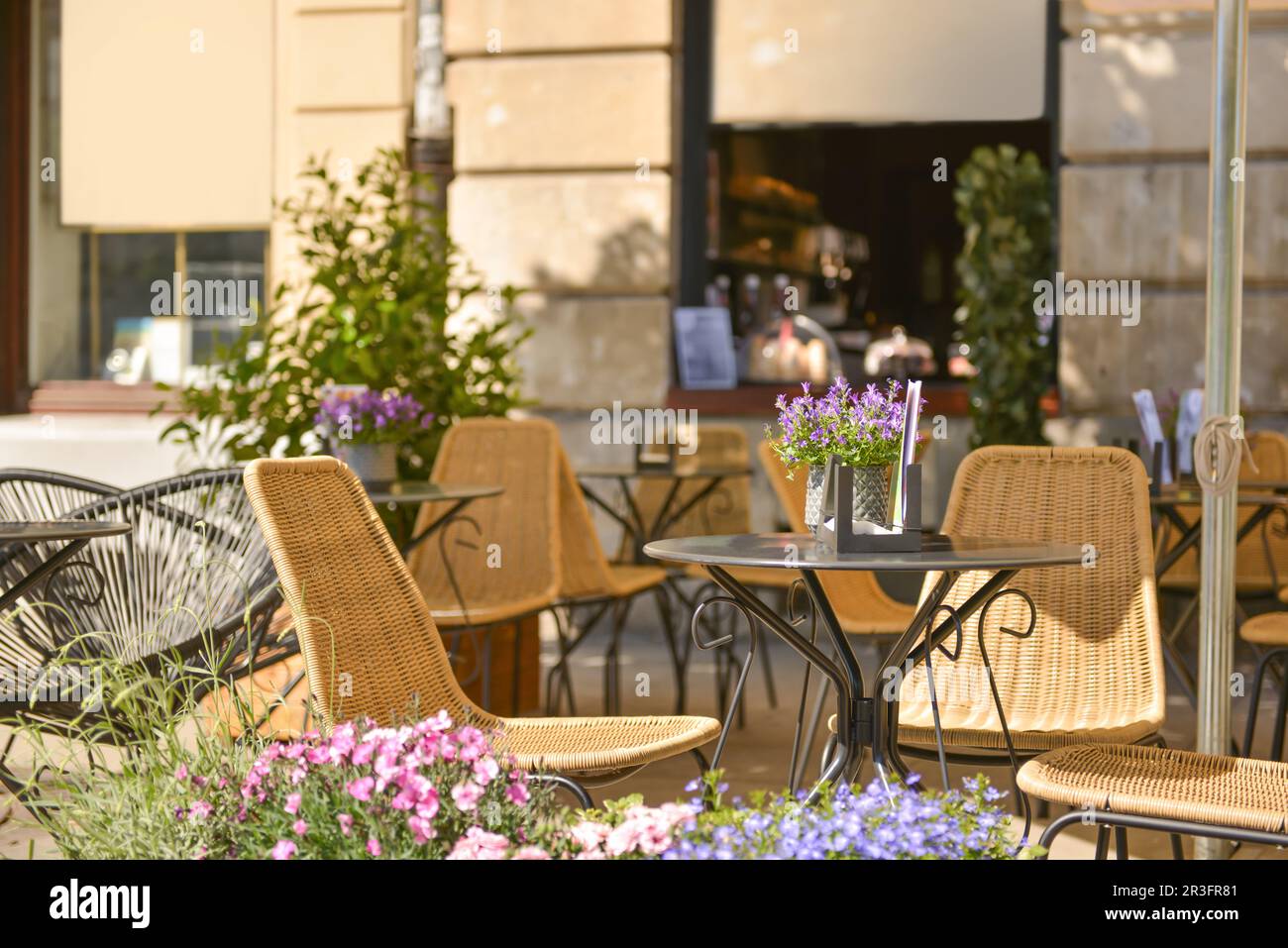 Outdoor cafe with beautiful flowers and comfortable furniture Stock ...