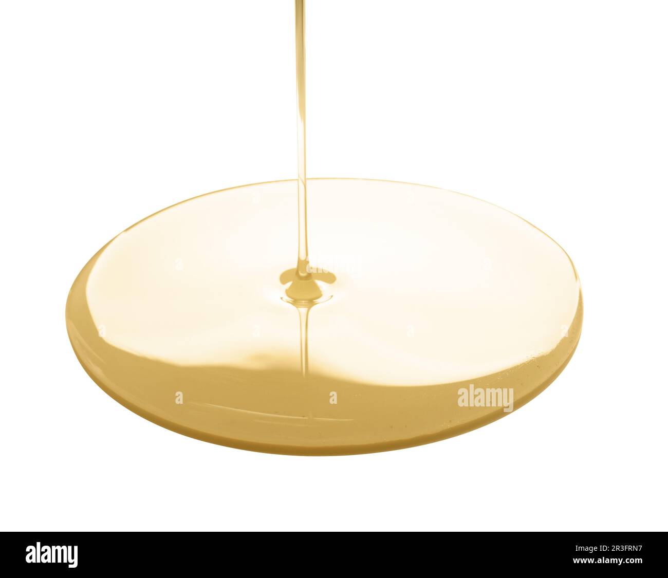 Vegetable oil pouring to puddle on white background Stock Photo - Alamy
